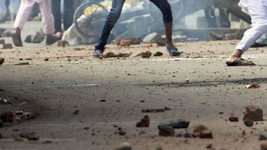 An irate mob pelted stones at police personnel and broke barricades ...